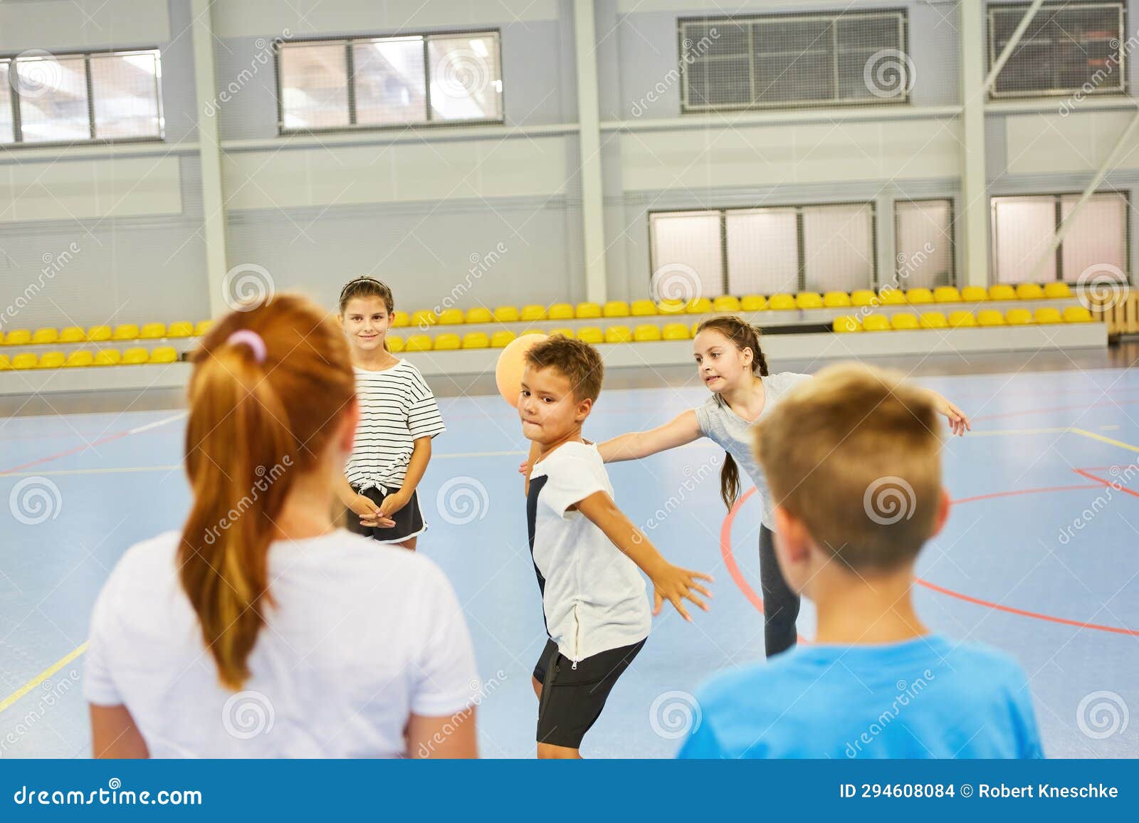 Boy Throwing Ball on Friends during Gym Class Stock Photo - Image of ...