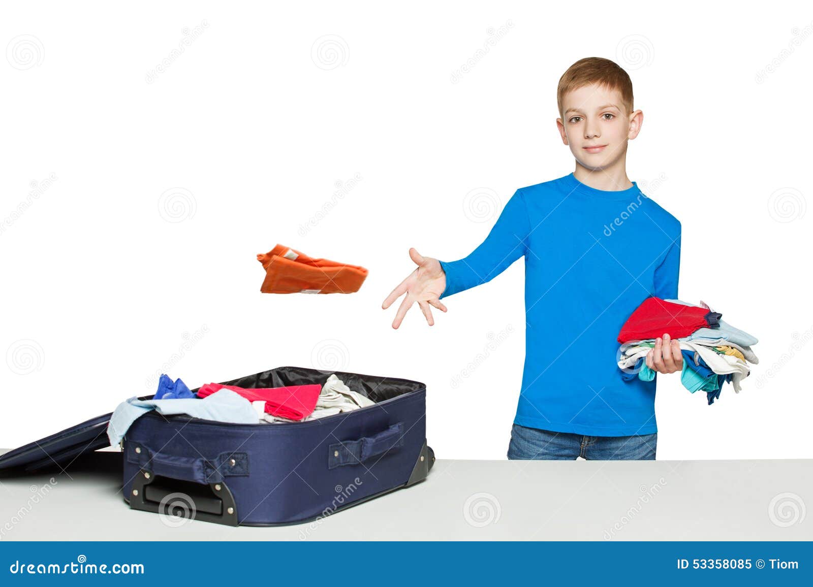 Boy Throwing Clothes To Luggage Bag Stock Image - Image of traveling ...