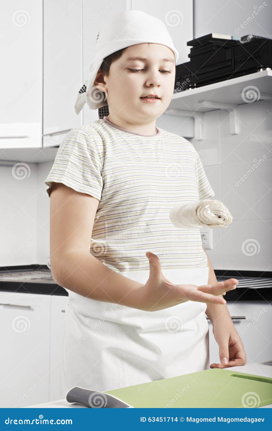 Boy throwing dough up stock photo. Image of dough, people - 63451714