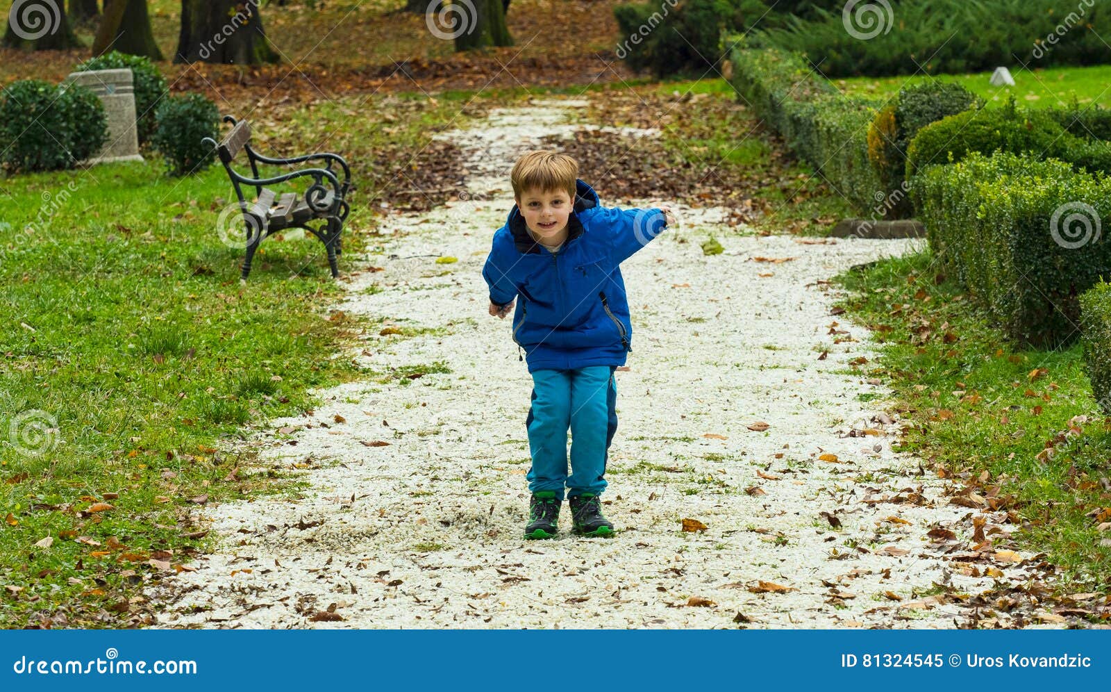 Boy throwing pebbles stock image. Image of childhood - 81324545