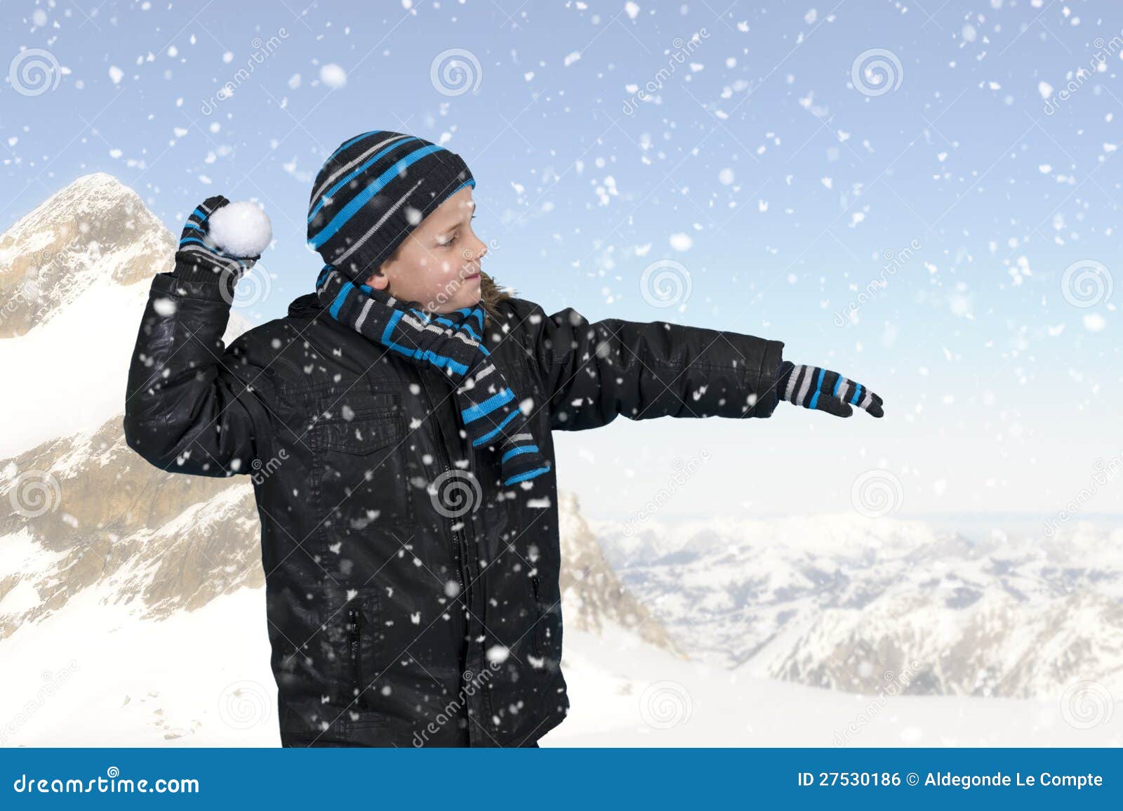 Boy Throwing a Snowball Outdoors in the Mountains Stock Photo - Image ...