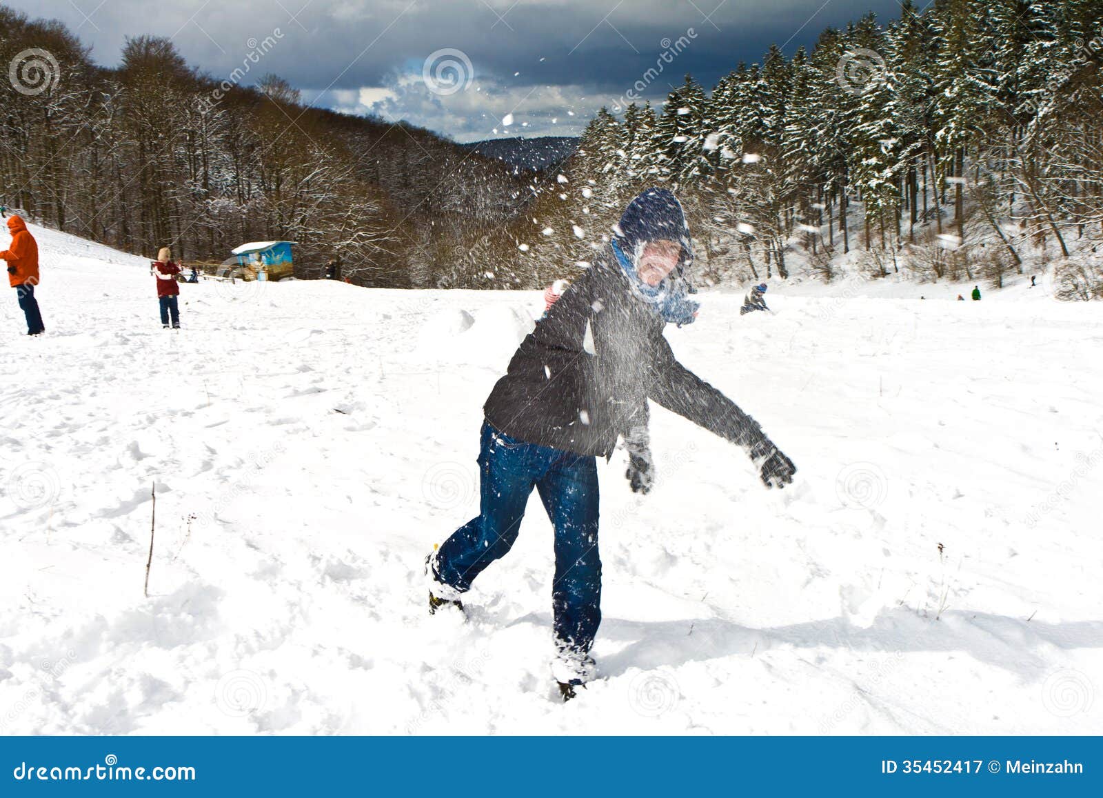 Boy is Throwing a Snowball in Wintry Landscape Stock Image - Image of ...
