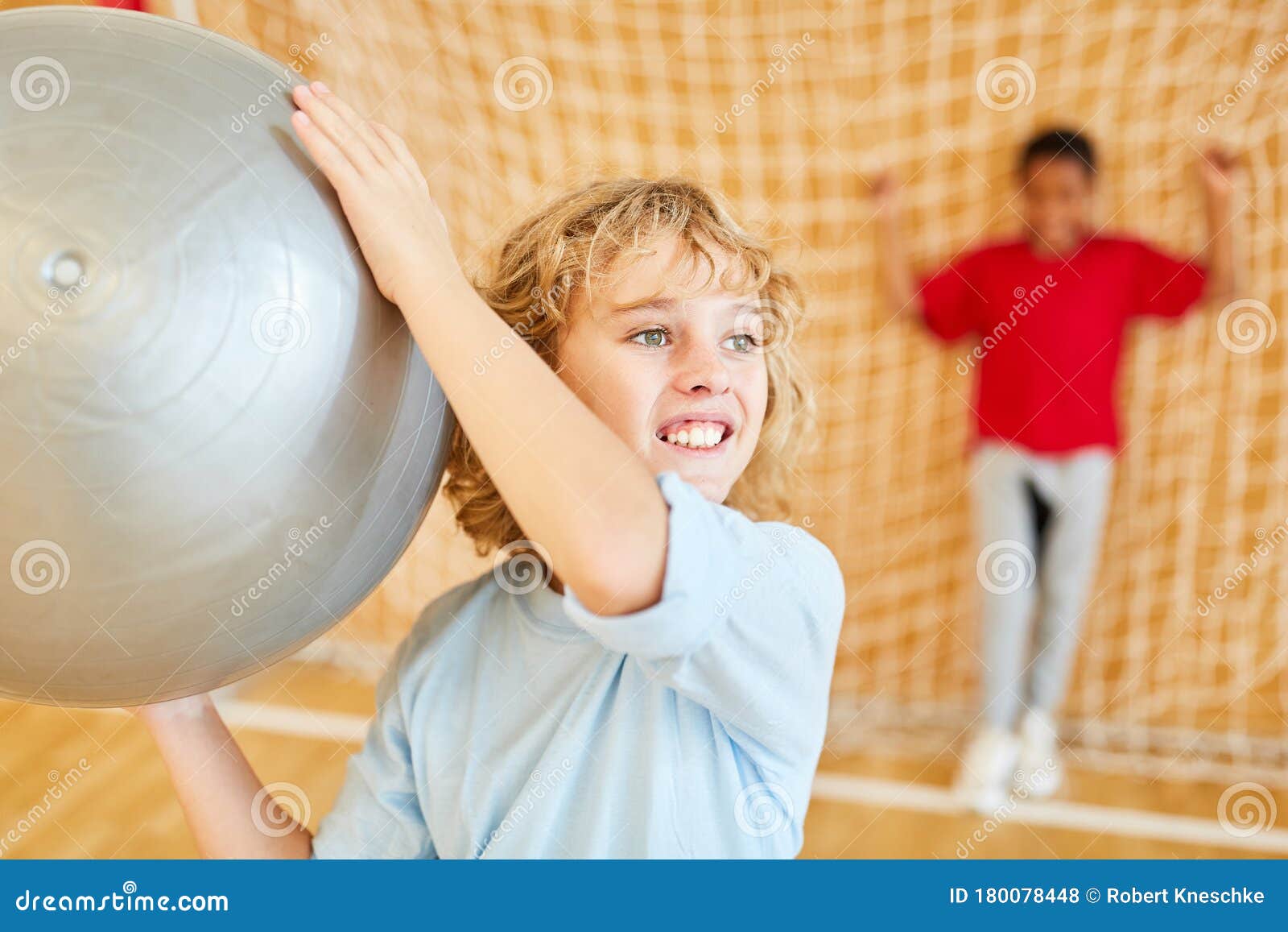Boy throws a gym ball stock photo. Image of physical - 180078448