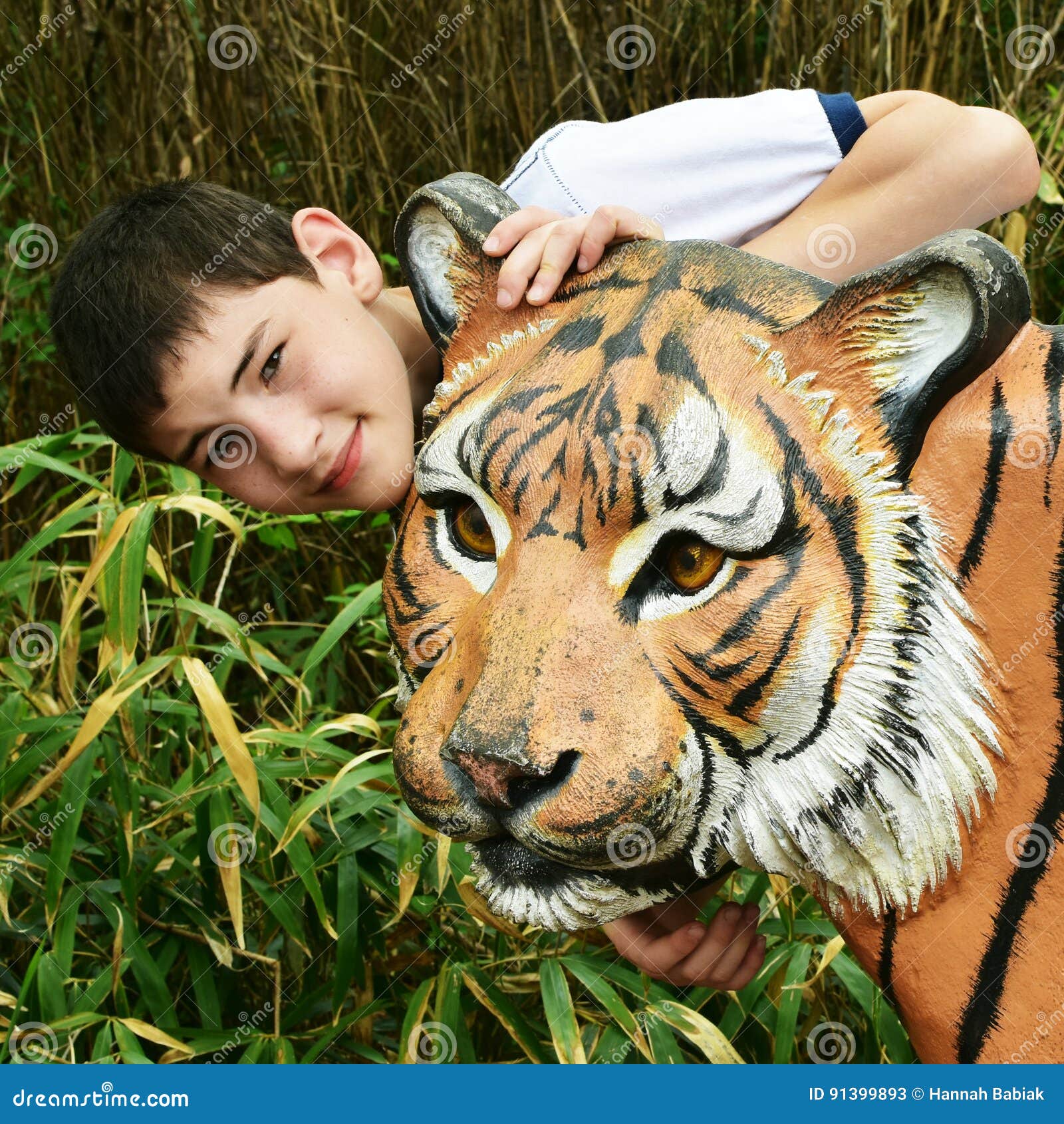 Boy with Tiger Statue stock image. Image of stripes, children - 91399893