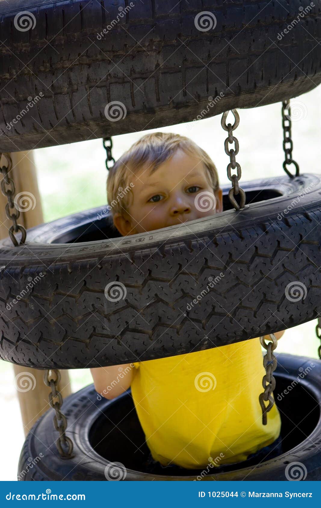 Boy in tires stock photo. Image of park, face, young, eyes - 1025044