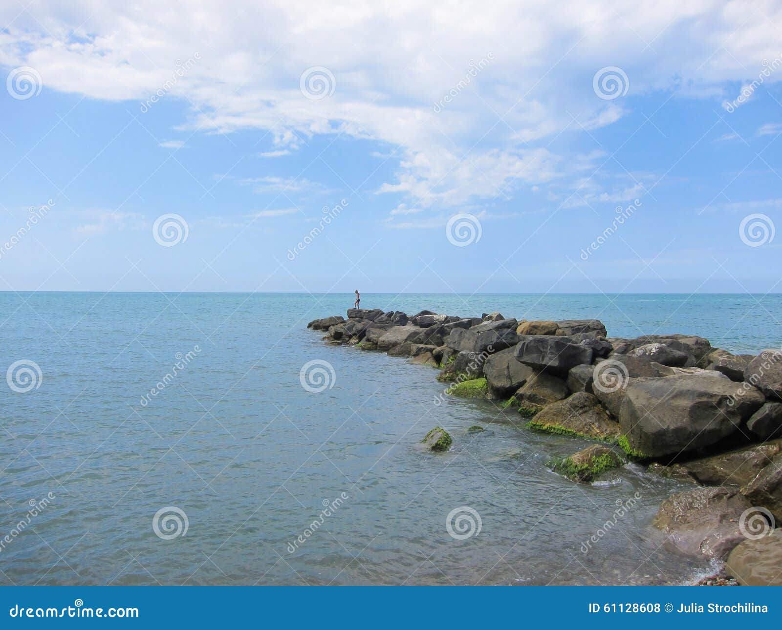 The Boy is on the Toe of the Breakwater Stock Photo - Image of water ...