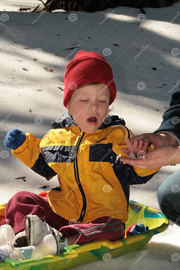 Boy Touching Ice for the First Time Stock Photo - Image of jacket, blue ...