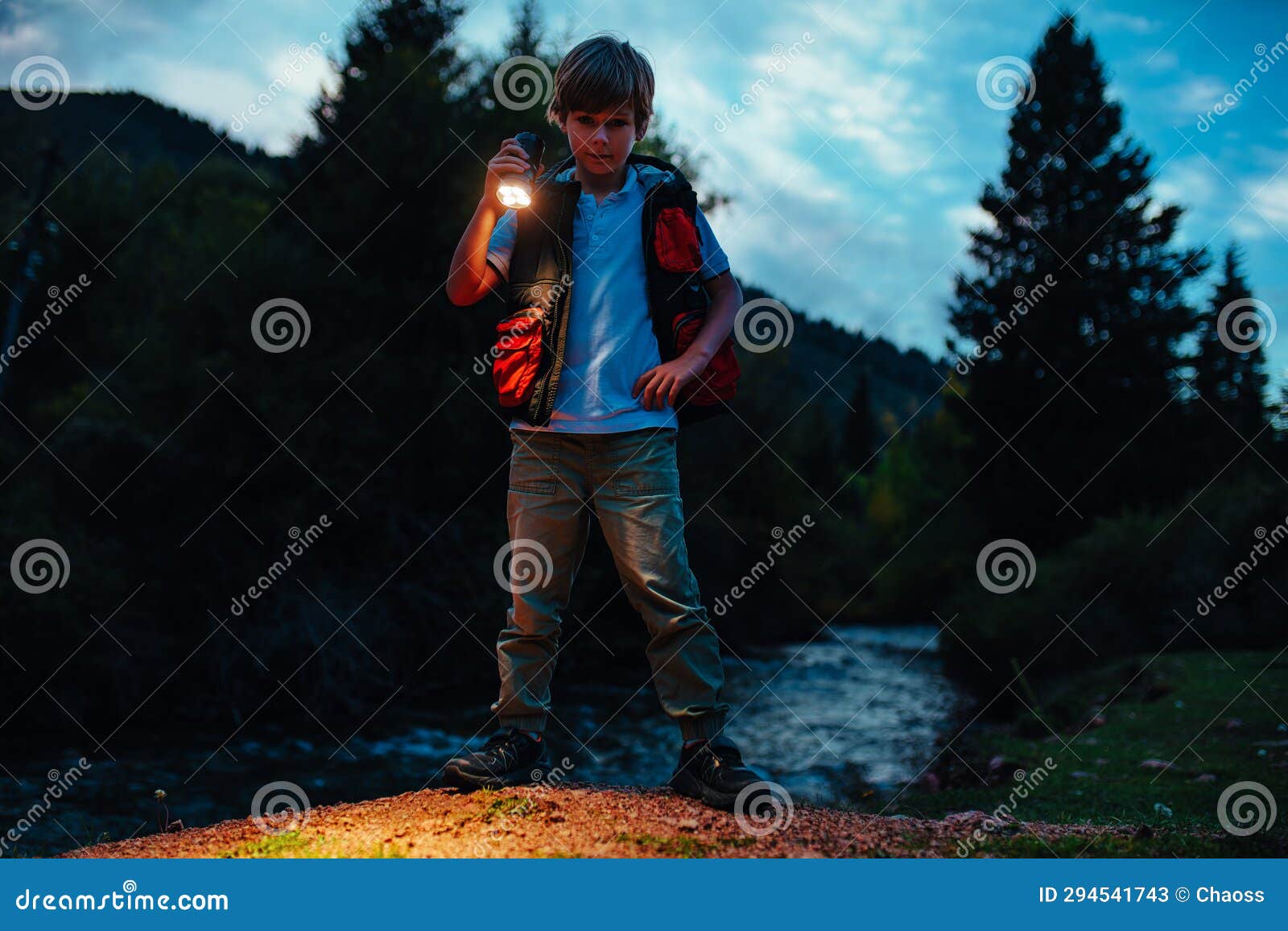 Boy Tourist with Flashlight Standing in Natural Park at Twilight Stock ...