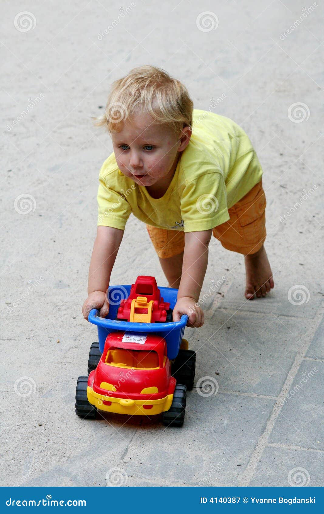 Boy Pushing Toy Popper