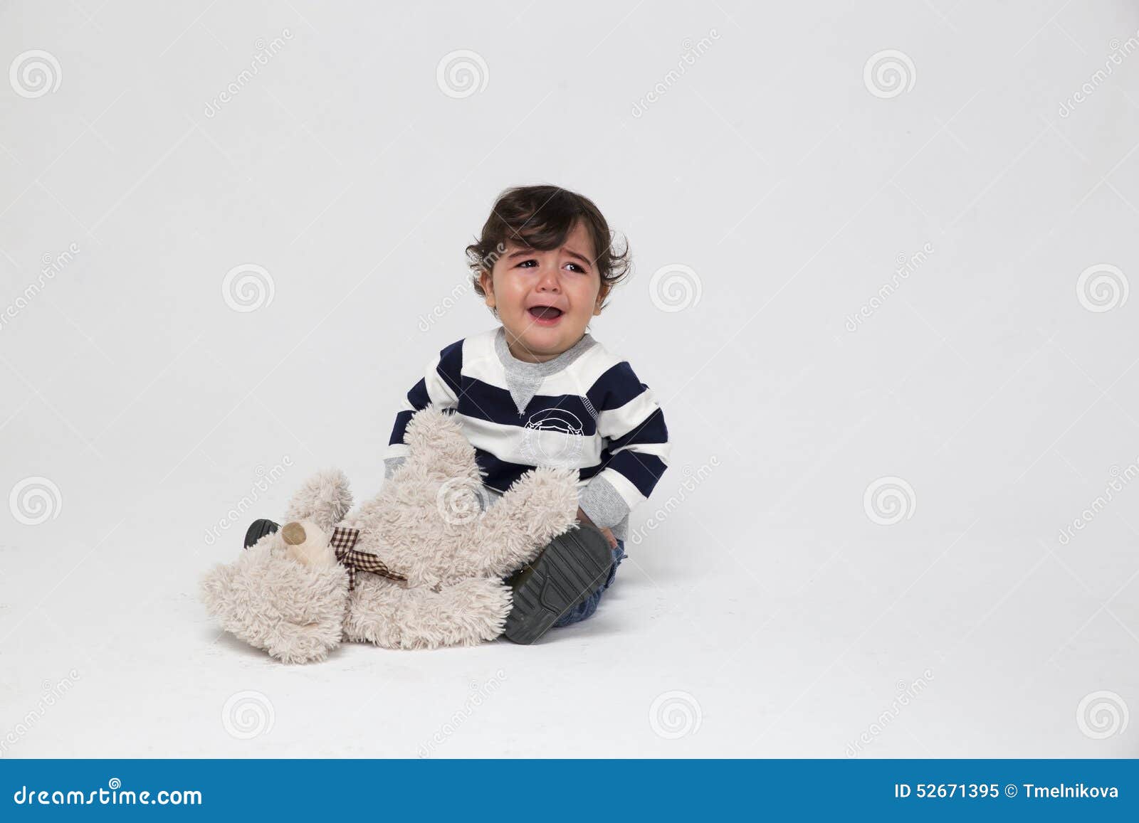 Boy With A Toy Crying In Studio On A White Stock Image - Image of ...