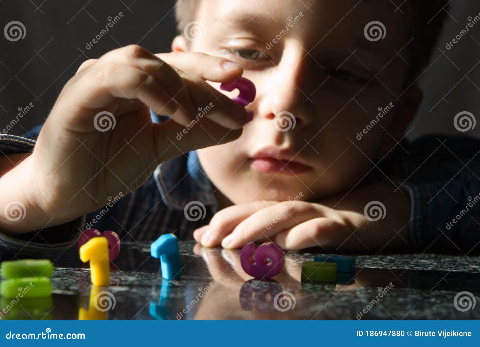 Boy with numbers stock photo. Image of finger, child - 186947880