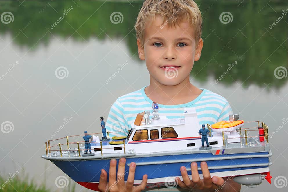 Boy with Toy Ship in Hands Ashore Stock Image - Image of boat, human ...