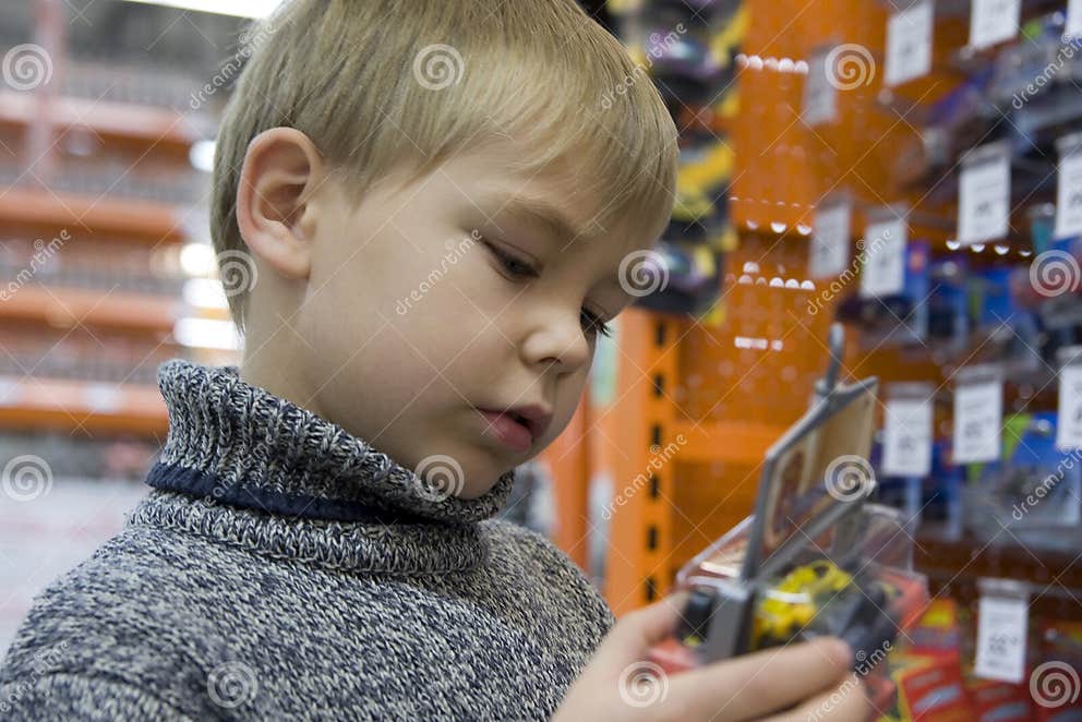 Boy in a toy store stock image. Image of scrutinize, game - 11531547