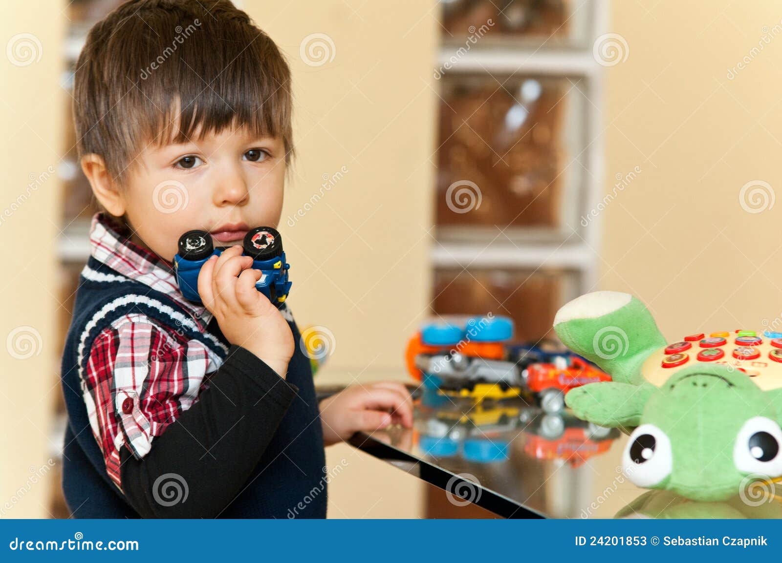 Boy with toys stock image. Image of portrait, stands - 24201853