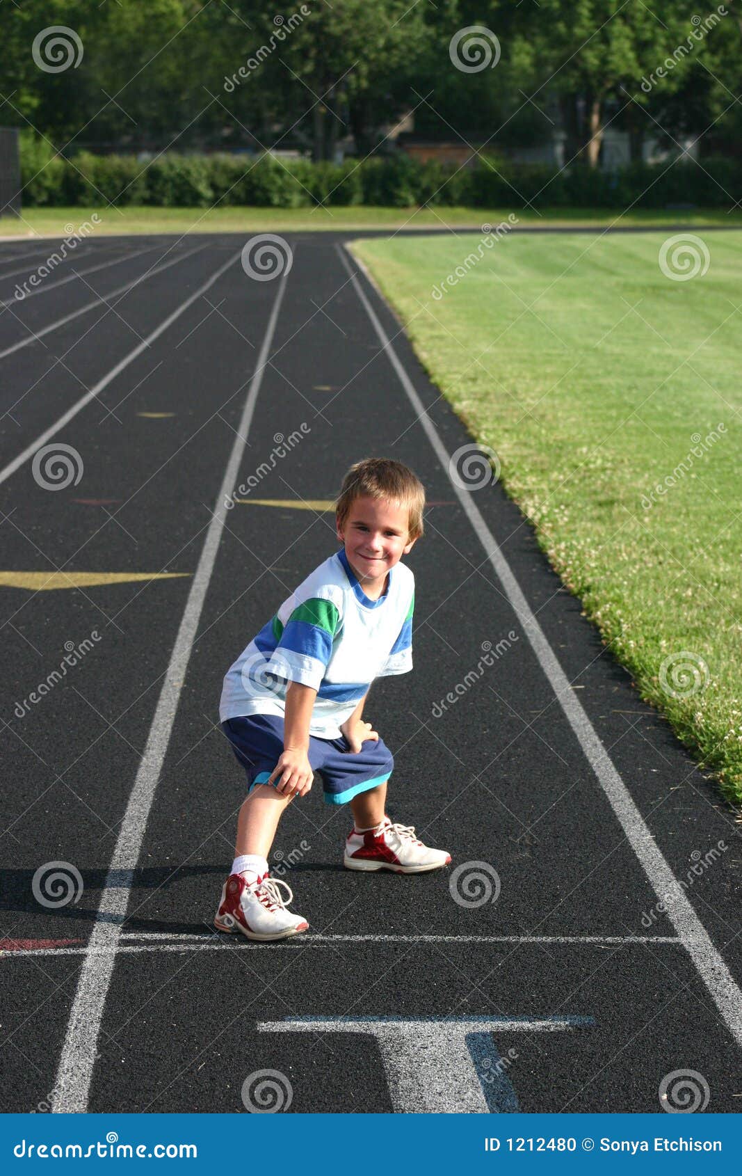 Boy on Track stock photo. Image of outdoor, laughter, childhood - 1212480