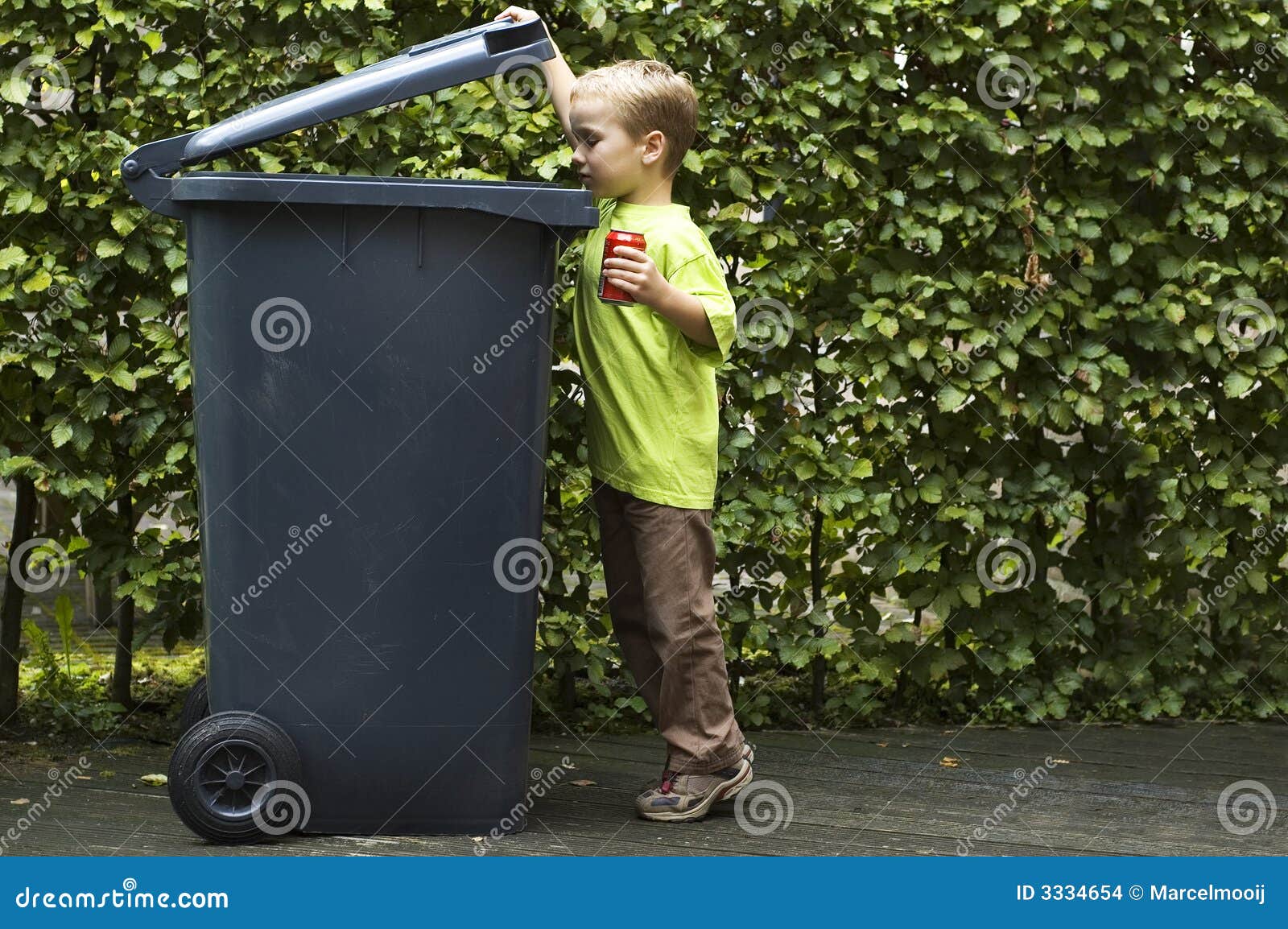 Boy Trashing a Can stock photo. Image of wastecan, rubbish - 3334654