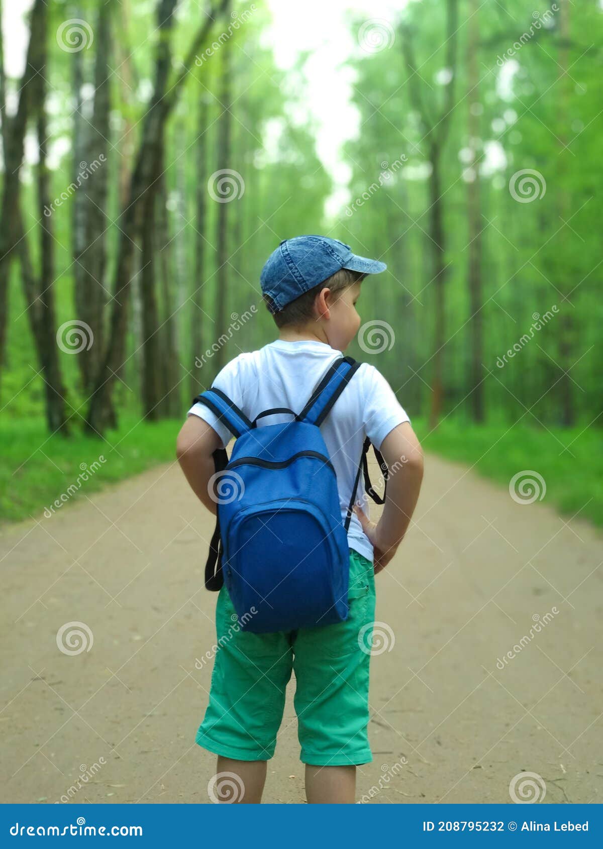 The Boy is Traveling with a Backpack on His Back Stock Photo - Image of ...