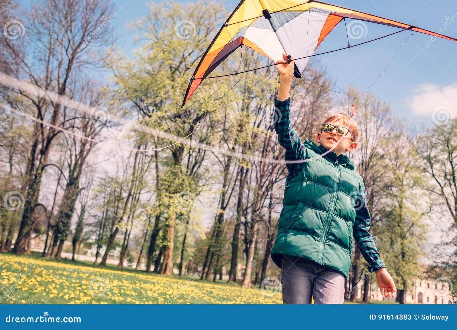 Boy try to start fly kite stock image. Image of meadow - 91614883