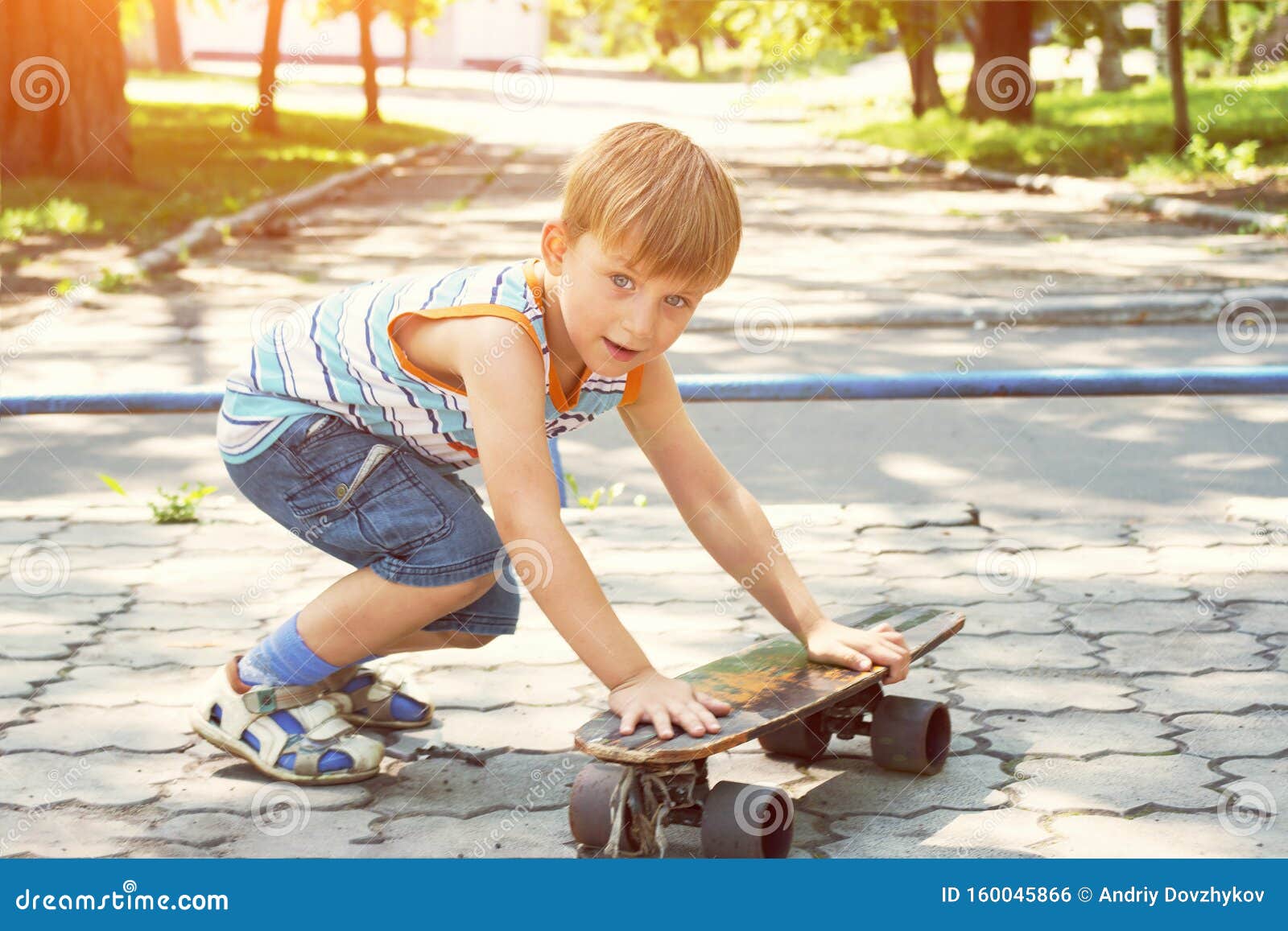 The Boy is Trying To Jump on a Skate and Ride on it Stock Photo - Image ...