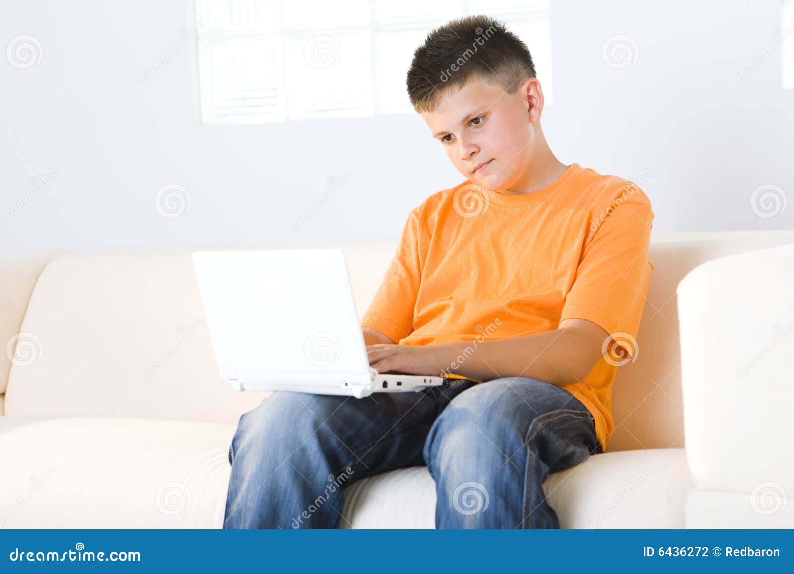Boy typing on laptop stock photo. Image of play, chat - 6436272