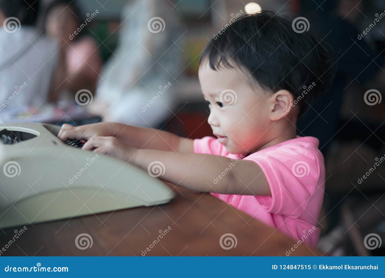 A Boy is Typing on the Typewriter at the Coffee Cafe. Stock Image ...