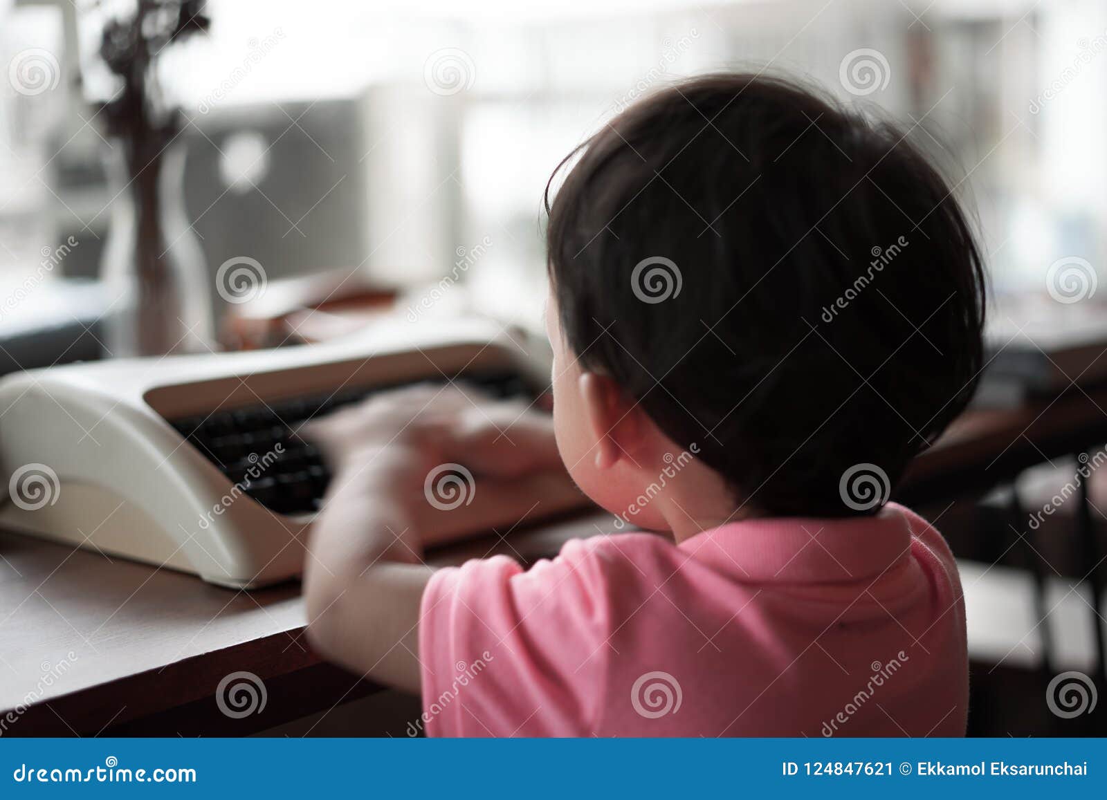 A Boy is Typing on the Typewriter at the Coffee Cafe. Stock Image ...