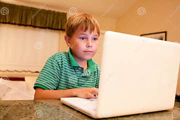 Boy typing on white laptop stock image. Image of keyboard - 22809011