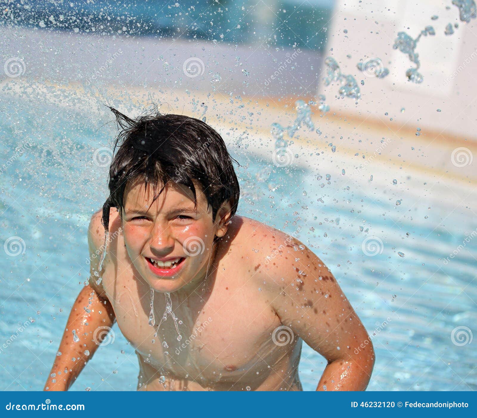 Boy Under the POWERFUL Jet of Water in the Pool in Summer Stock Photo ...