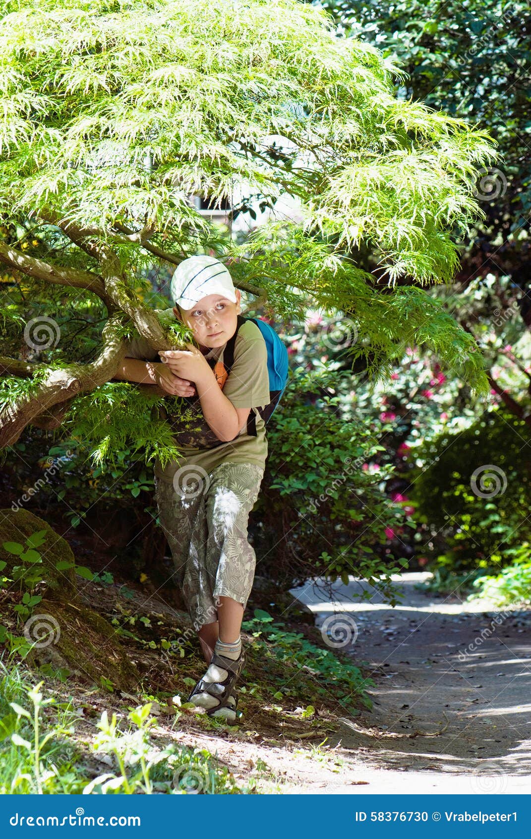 Boy under the tree stock photo. Image of children, freetime - 58376730