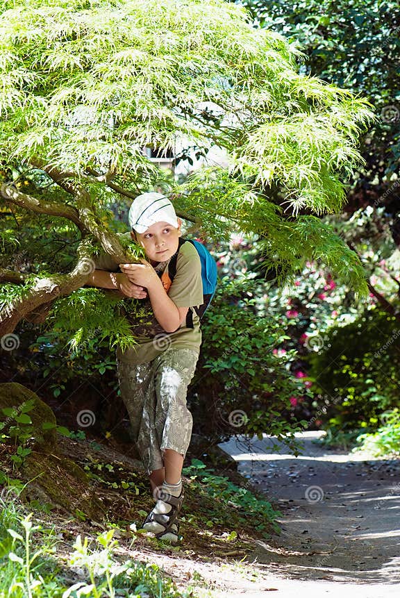 Boy under the tree stock photo. Image of children, freetime - 58376730