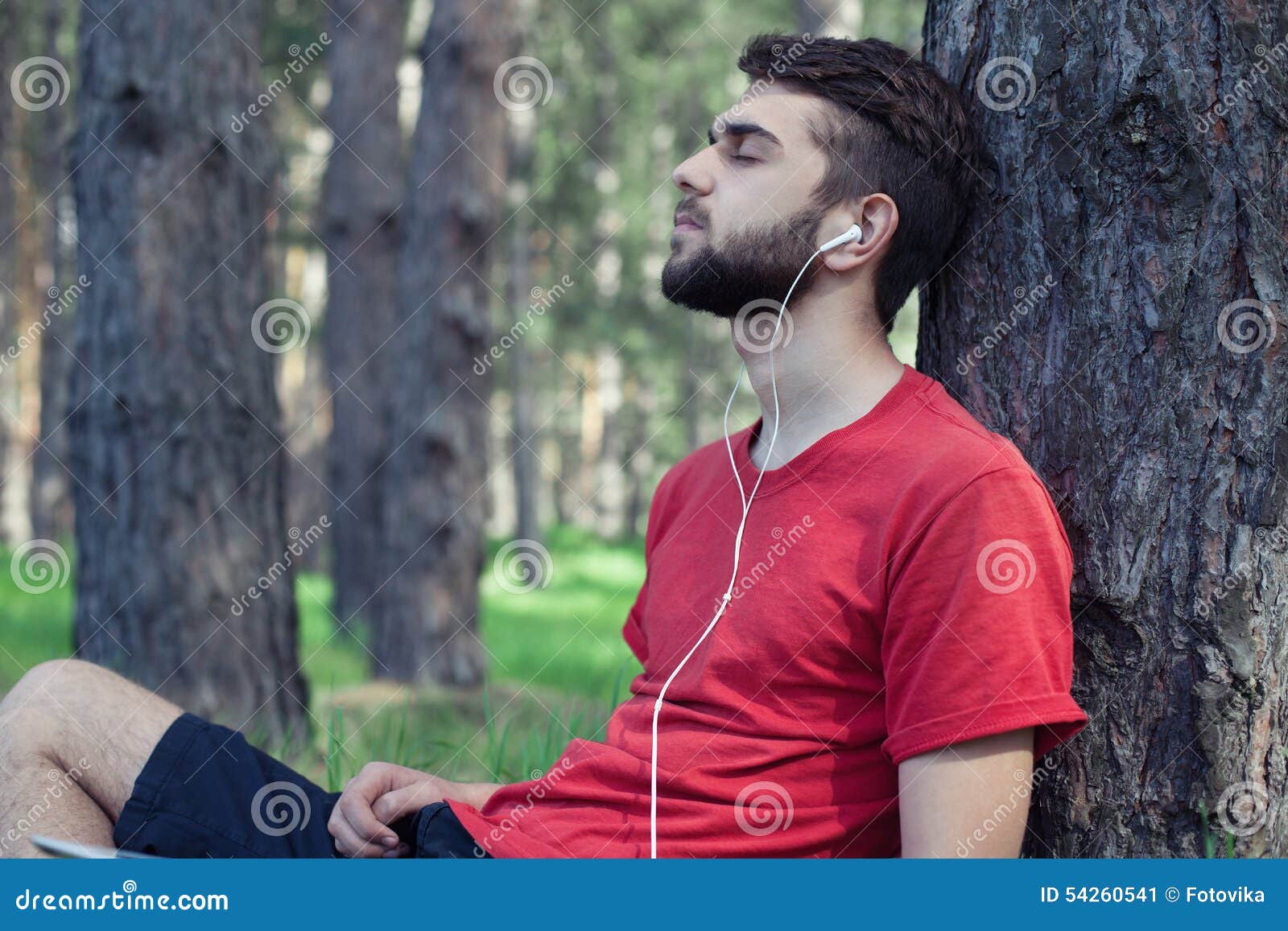 Boy under a tree stock image. Image of pleasure, green - 54260541