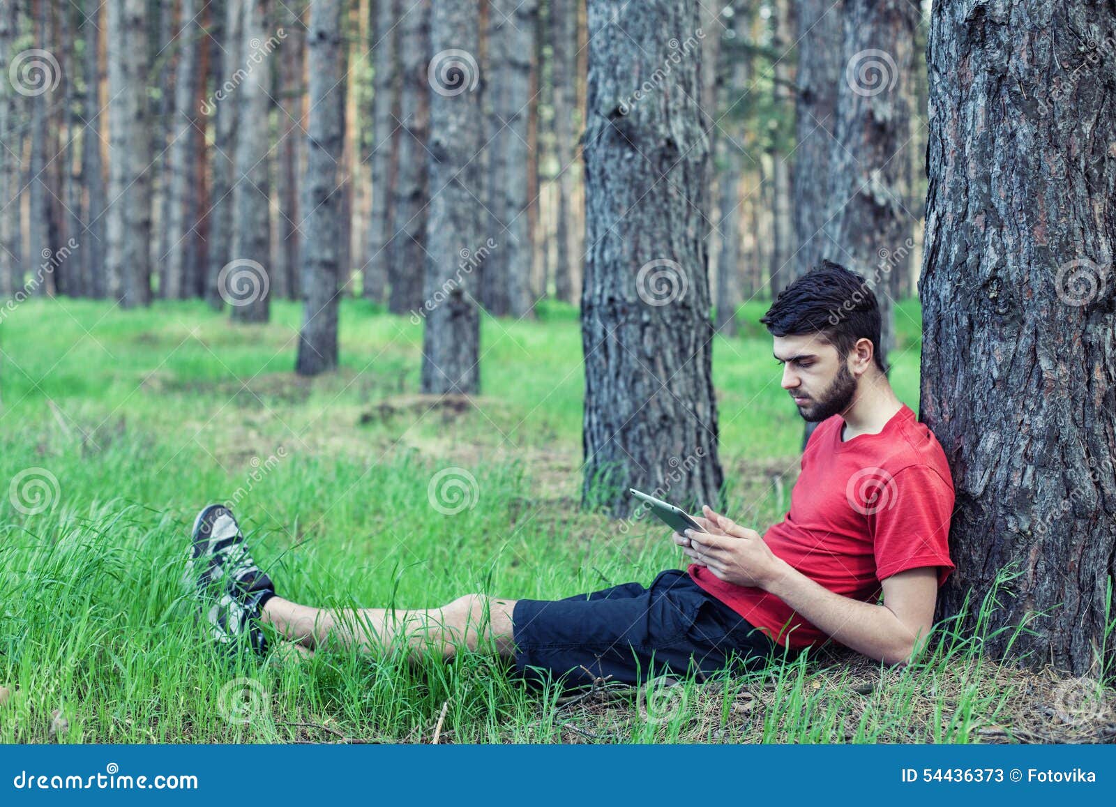 Boy under a tree stock image. Image of pleasure, read - 54436373