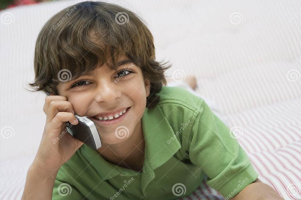 Boy Using Cell Phone stock photo. Image of multiethnic - 29662546