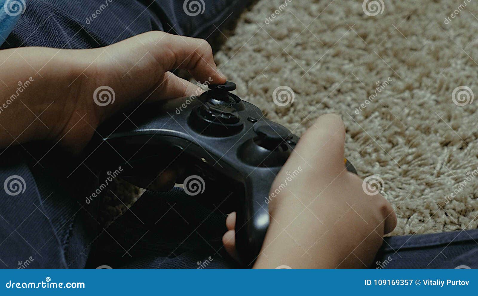 Boy Using a Controller To Play a Video-game Stock Image - Image of ...