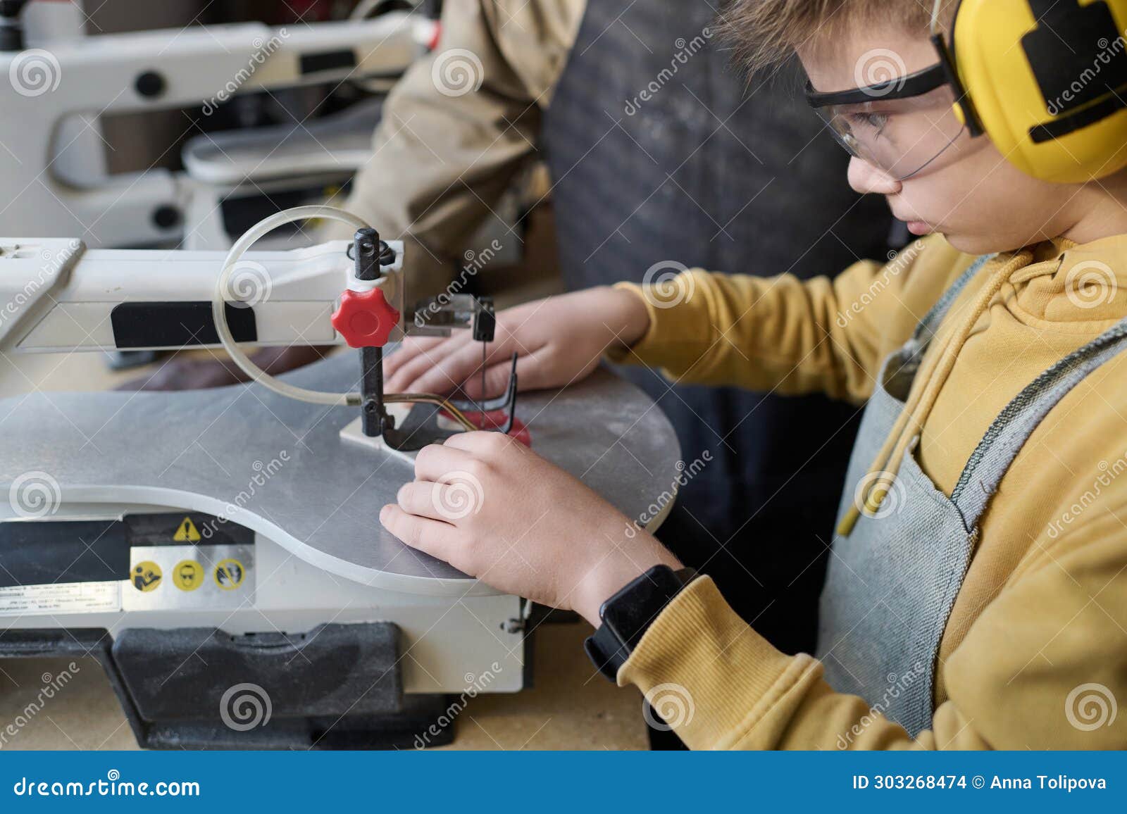 Boy Using Cutting Machine in Carpentry Workshop Stock Photo - Image of ...