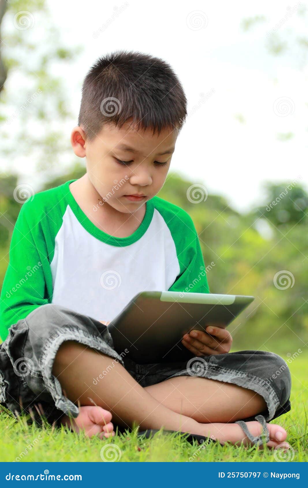 Boy using digital tablet stock image. Image of child - 25750797