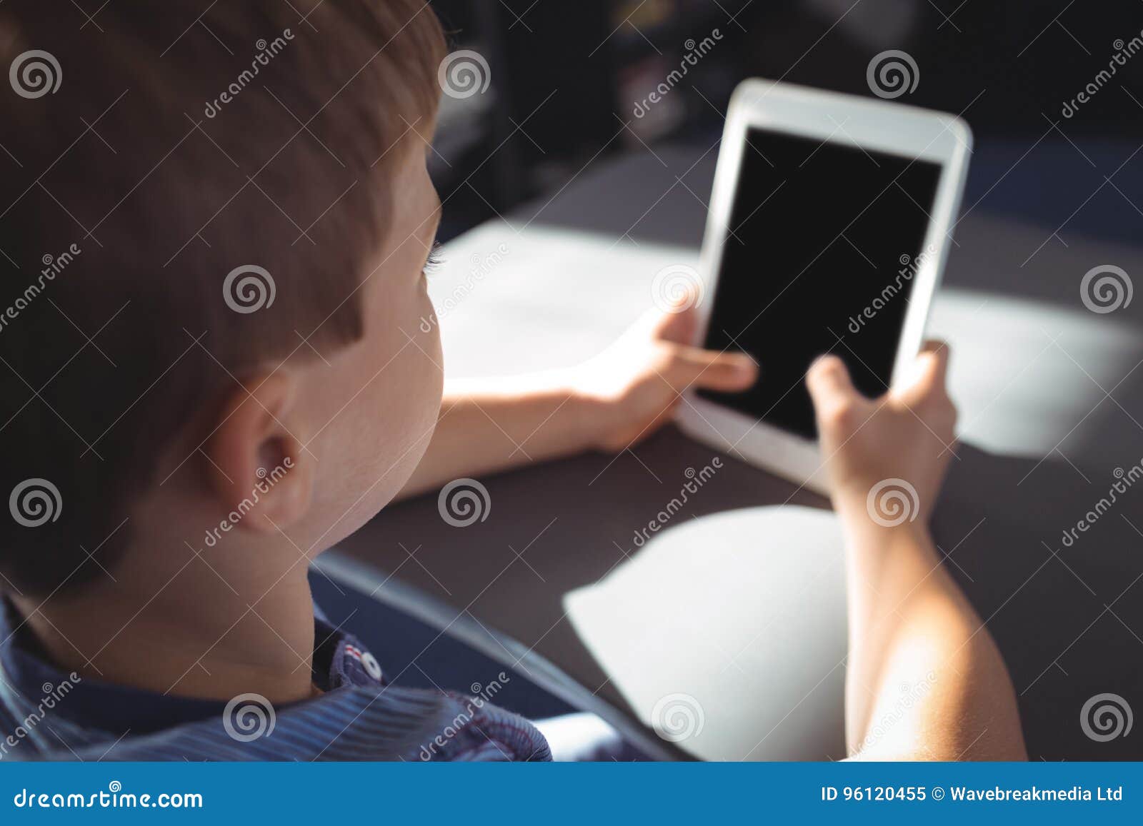 Boy Using Digital Tablet at Desk Stock Image - Image of sitting ...