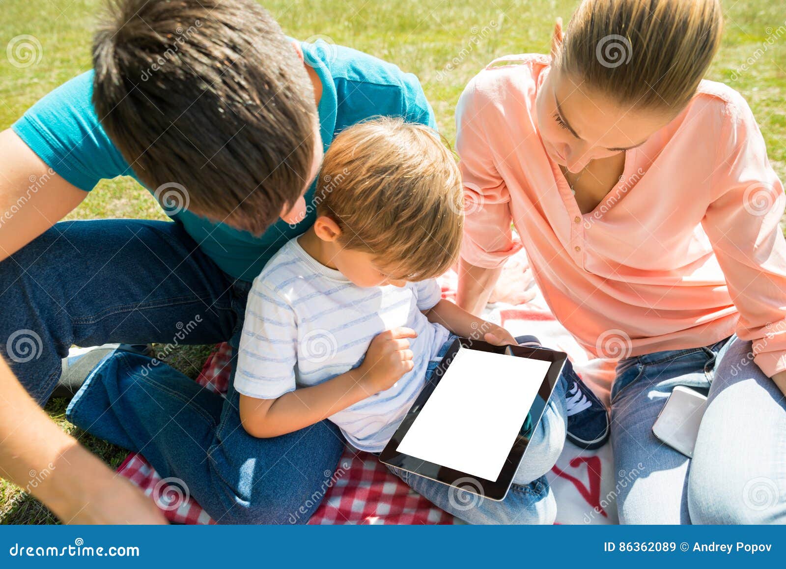 Boy Using Digital Tablet with His Parent Stock Image - Image of people ...