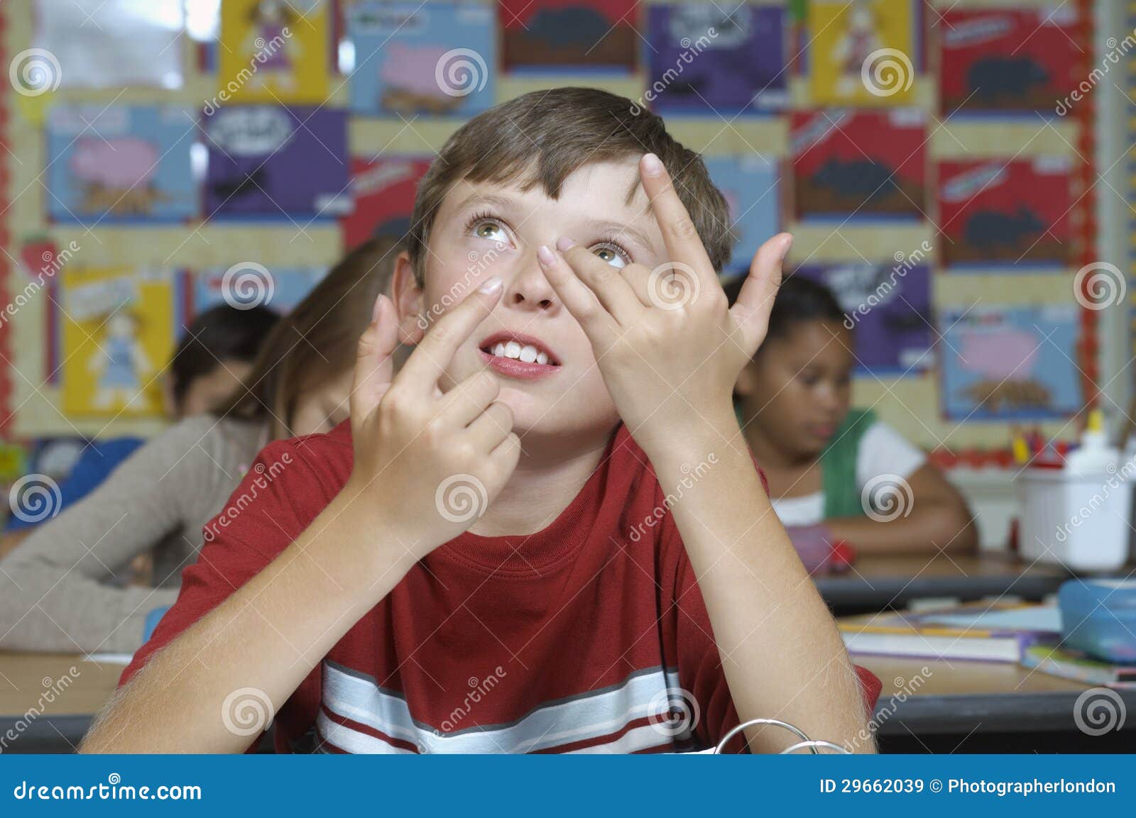 Boy Using Fingers To Count in Classroom Stock Image - Image of american ...