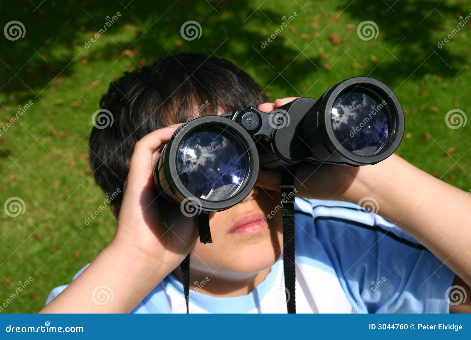 Boy Using His Binoculars stock photo. Image of binocular - 3044760