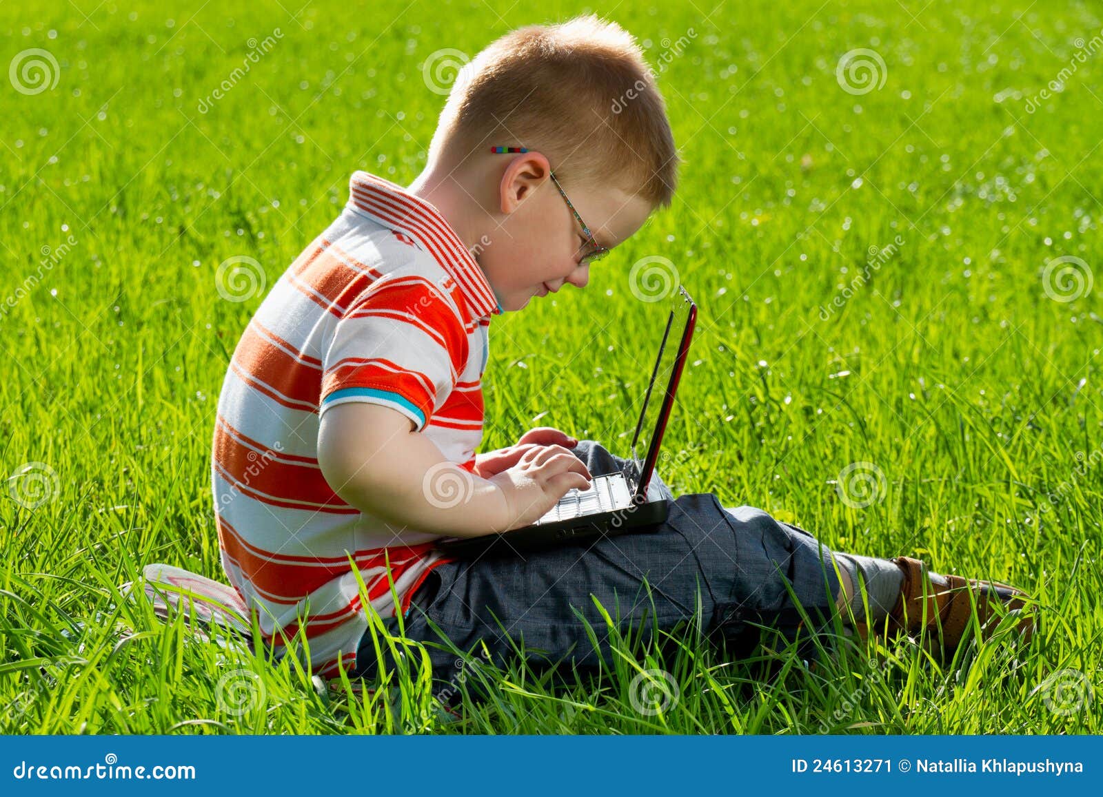 Boy Using His Laptop Outdoor in Park Stock Image - Image of field ...