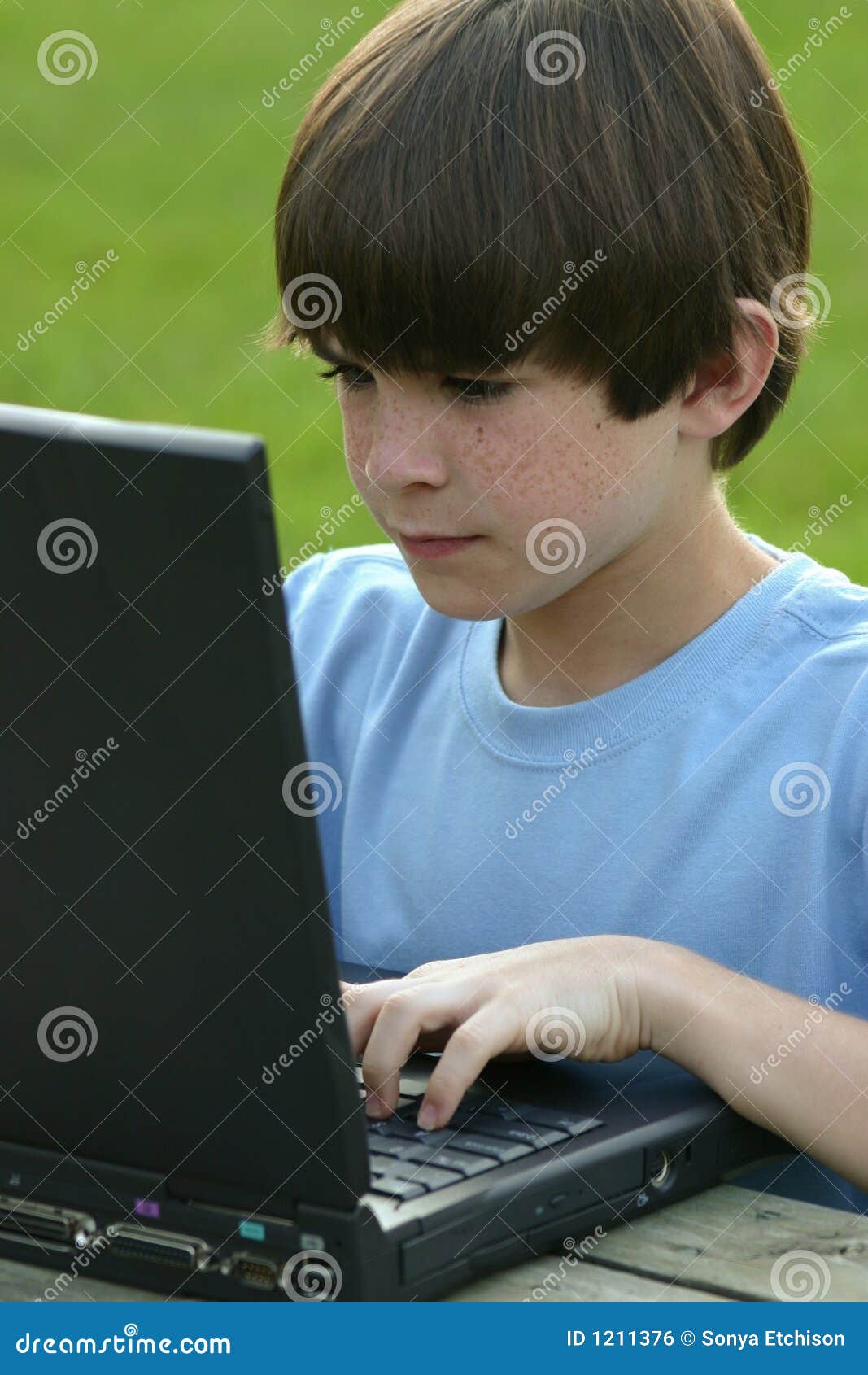 Boy Using Laptop stock photo. Image of learning, handsome - 1211376