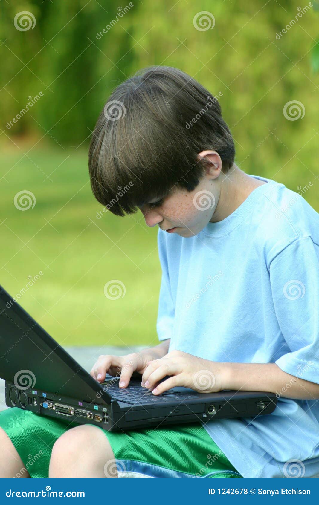 Boy Using Laptop stock photo. Image of research, close - 1242678