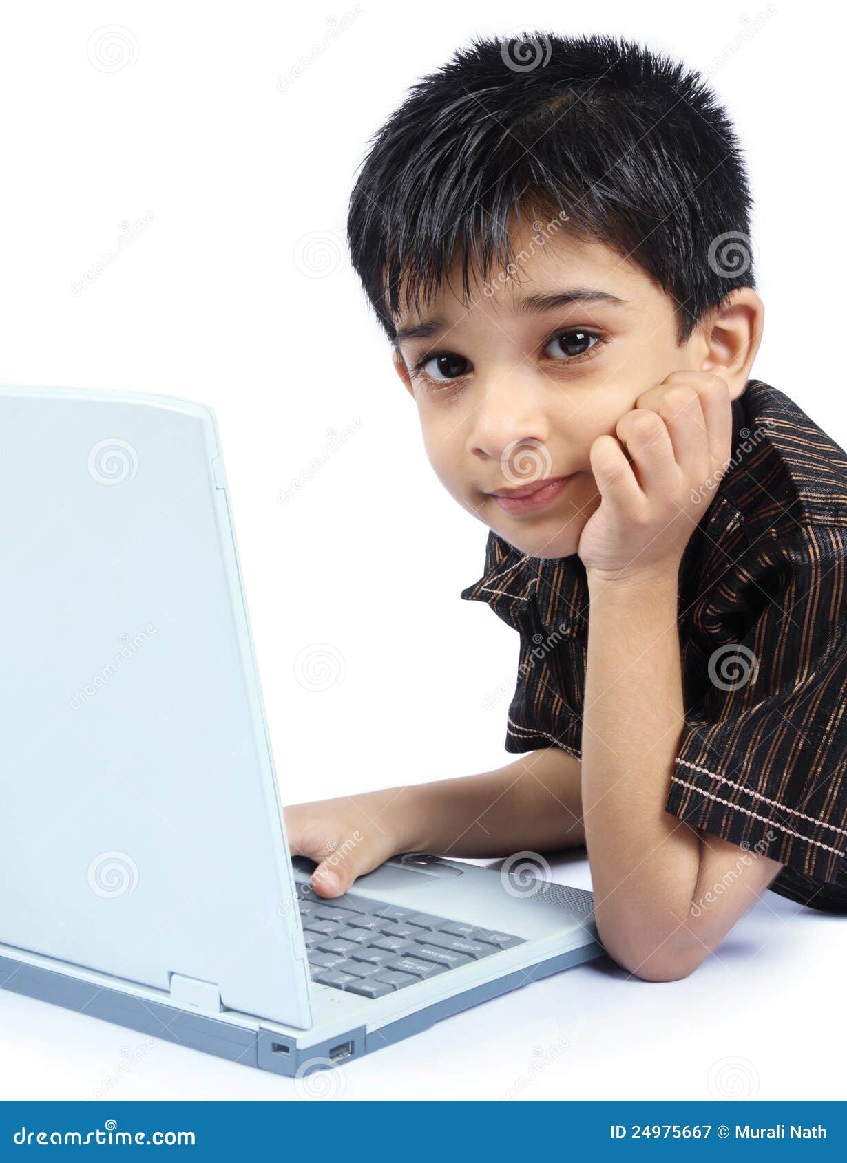 Boy using a laptop stock image. Image of leisure, lying - 24975667