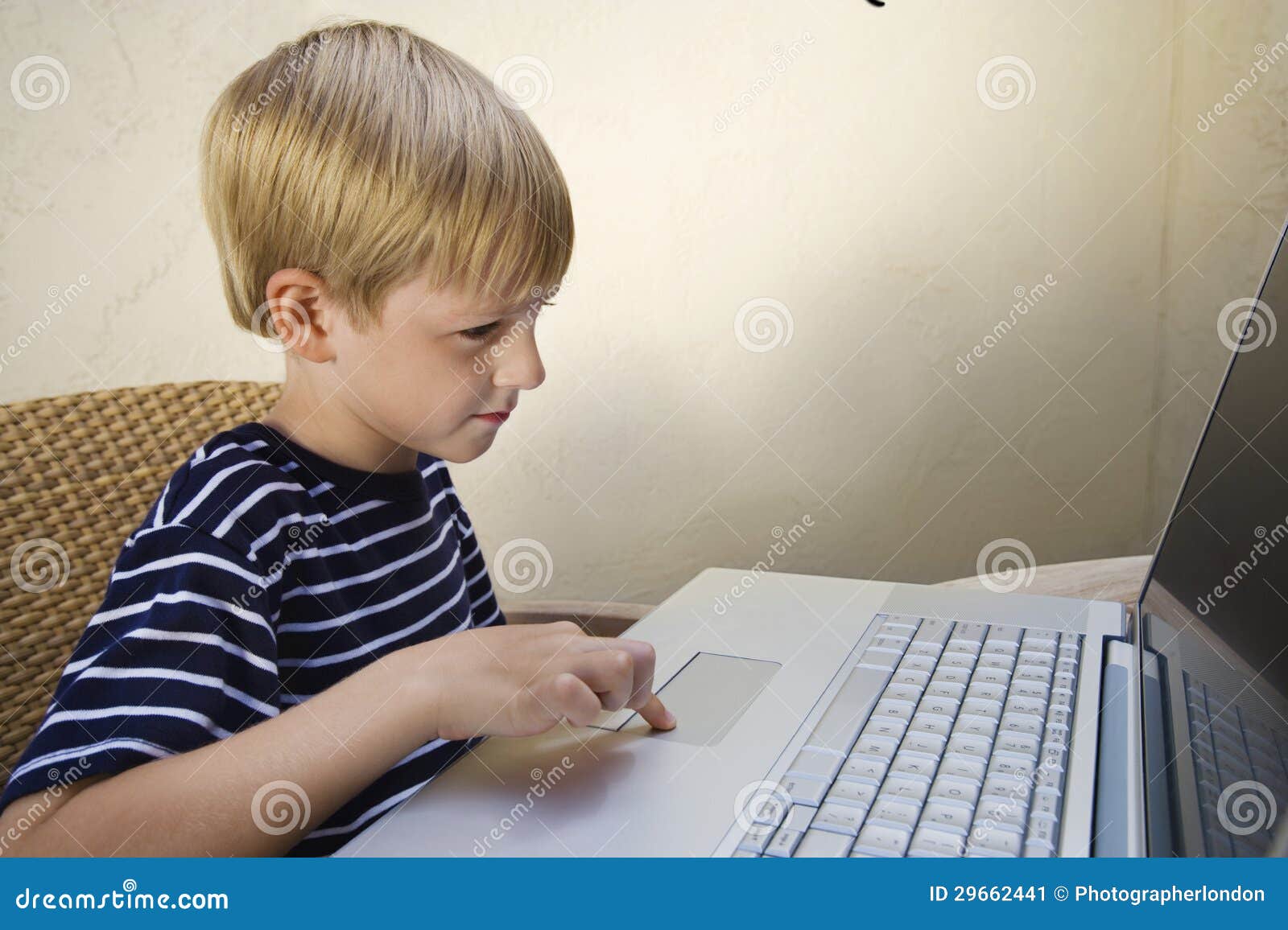 Boy Using Laptop stock image. Image of lifestyle, indoors - 29662441