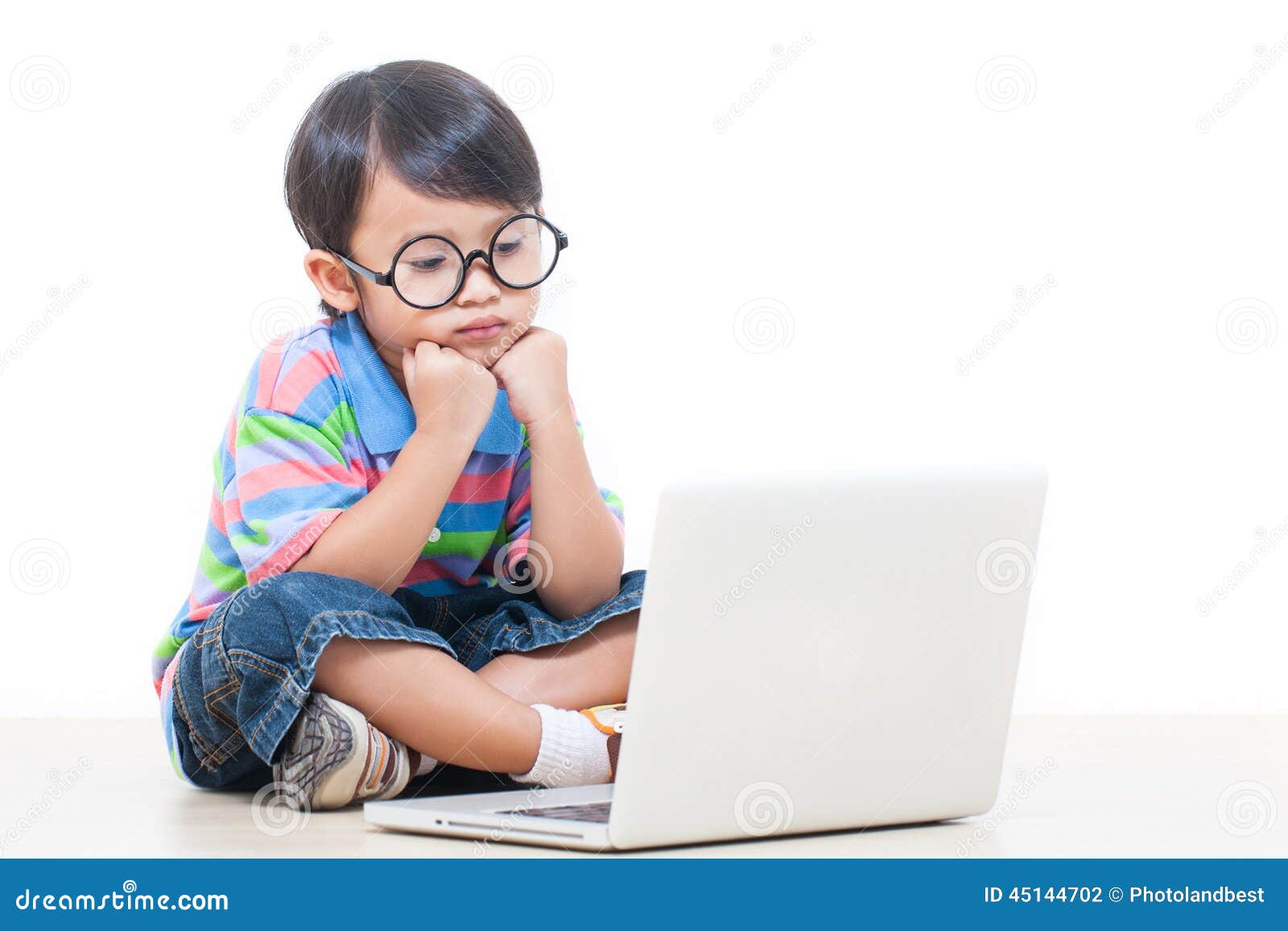 Boy using laptop computer stock photo. Image of expressing - 45144702