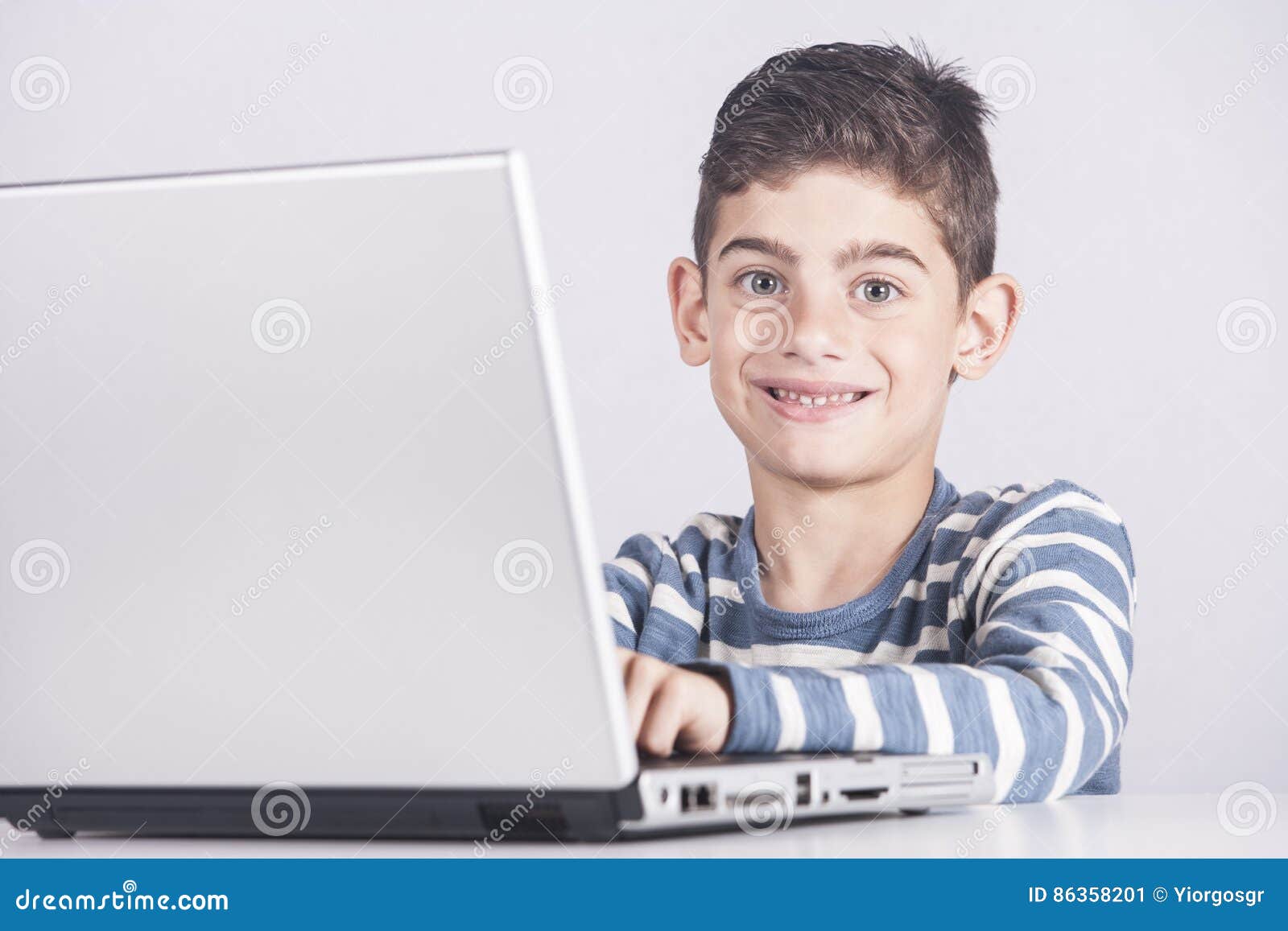 Boy Using a Laptop Computer Stock Image - Image of young, desk: 86358201
