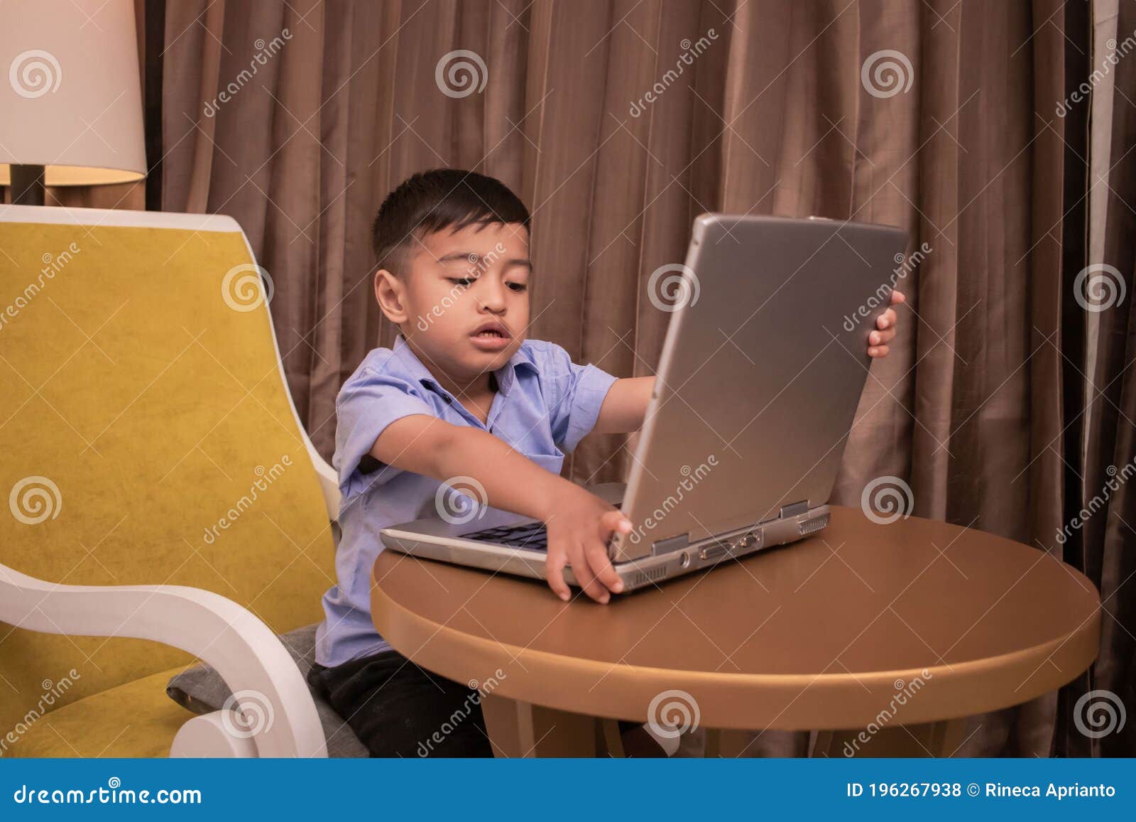 A boy using a laptop stock photo. Image of knowledge - 196267938