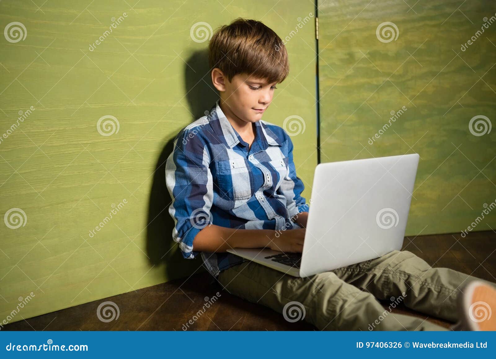 Boy using laptop at home stock photo. Image of communication - 97406326
