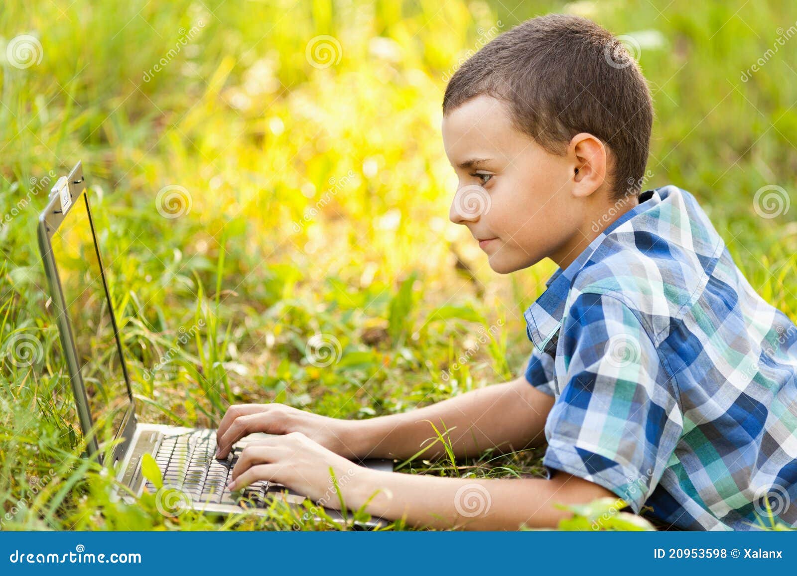 Boy using laptop outdoor stock photo. Image of leisure - 20953598